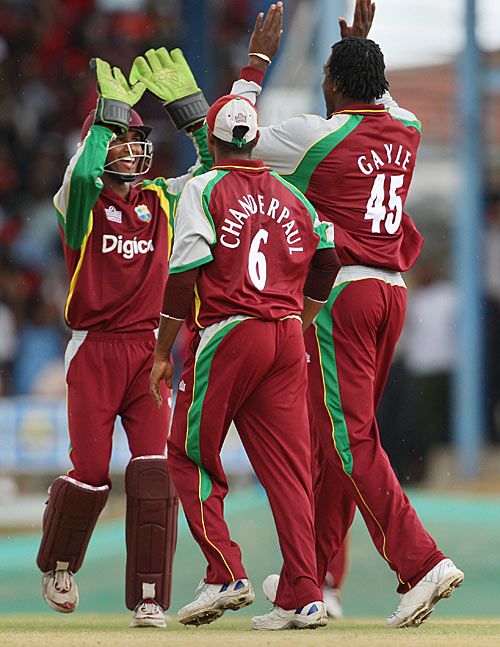 Denesh Ramdin congratulates Chris Gayle on another wicket ...