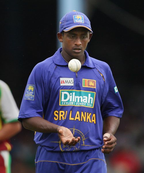 Ajantha Mendis considers his options after being given the ball ...