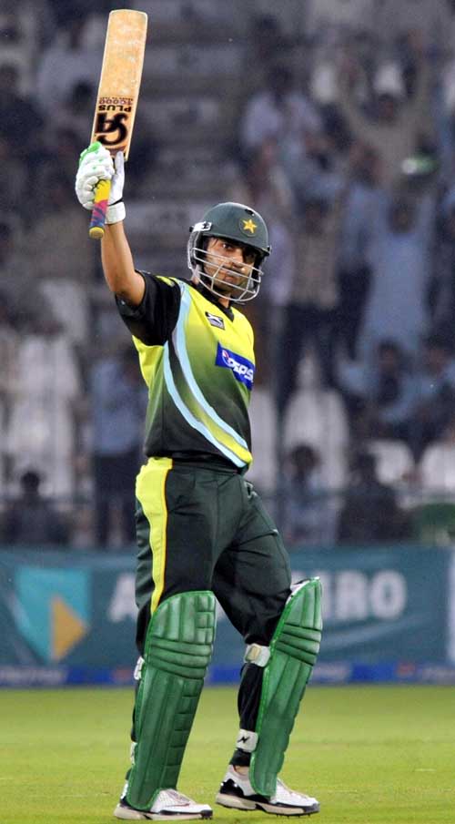 Salman Butt raises his bat after reaching his fifty | ESPNcricinfo.com