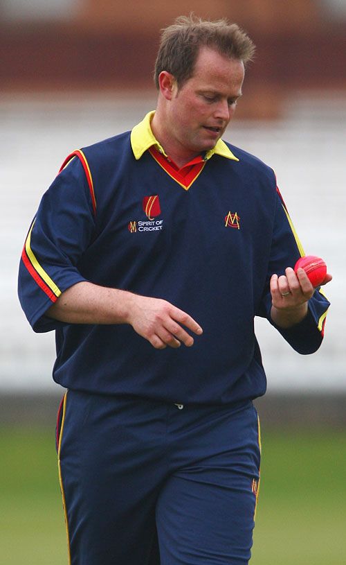 MCC's James Hamblin examines the pink ball during its trial at Lord's ...