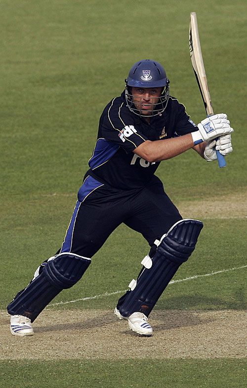 Chris Adams punches through the covers during his unbeaten 109 ...