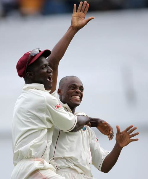 Darren Sammy congratulates Daren Powell on a wicket | ESPNcricinfo.com