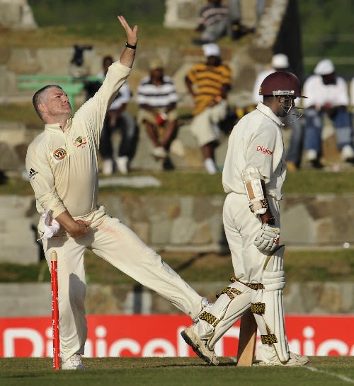Stuart MacGill runs in to bowl | ESPNcricinfo.com