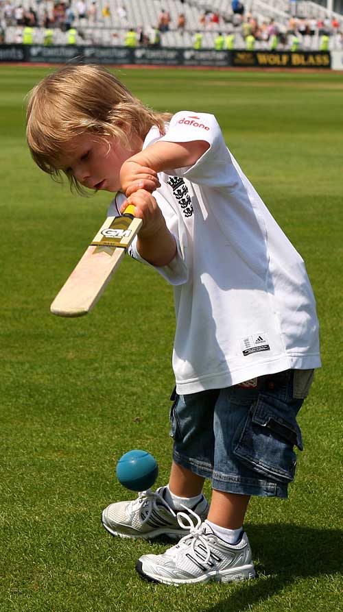 Like father, like son: Archie Vaughan practices his cover drive ...