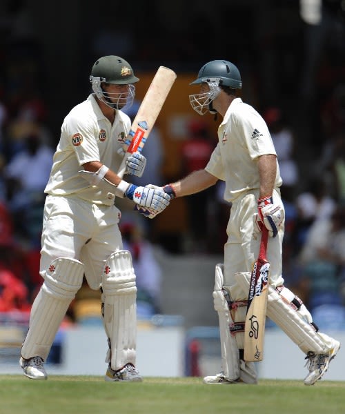 Phil Jaques and Simon Katich congratulate each other on a century stand ...
