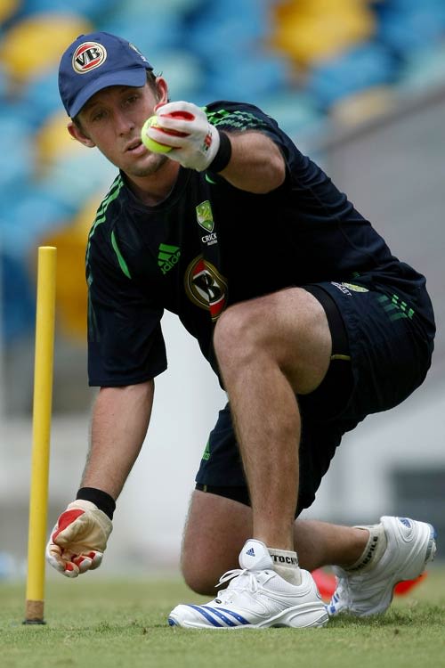 Luke Ronchi gets into the groove behind the stumps at a net session ...