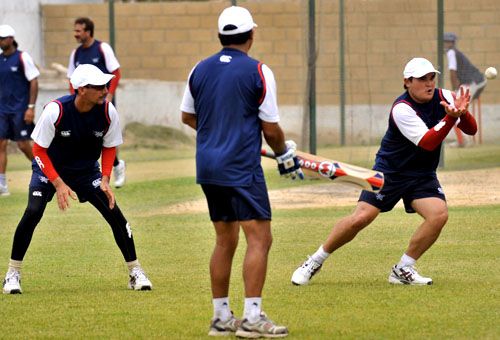 Roy Lamsam prepares to take a catch during Hong Kong's training session ...