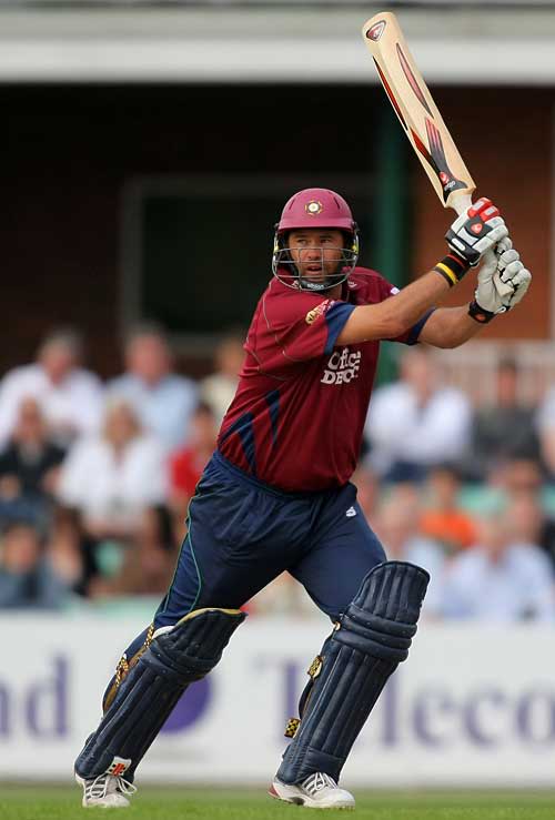 Andrew Hall thrashes through the off side during his half century ...