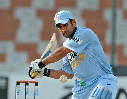 Mahendra Singh Dhoni is set to wallop the ball | ESPNcricinfo.com