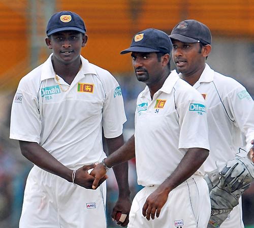 Ajantha Mendis is congratulated by Muttiah Muralitharan for his ten ...