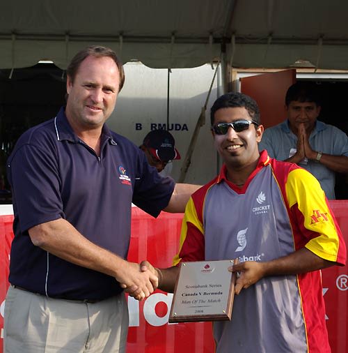 Karun Jethi receives the Man-of-the-Match award from Richard Done for ...