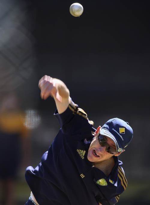 David Hussey sends down a delivery at Australia's training camp ...