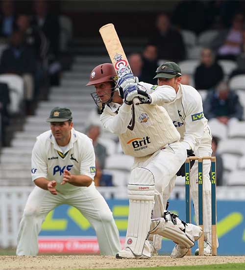 Lee Hodgson drives during his half-century on debut for Surrey ...