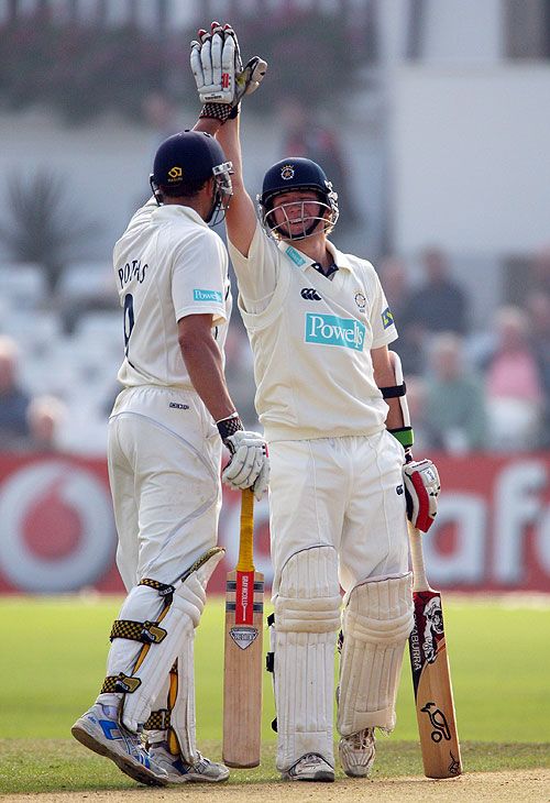 Nic Pothas congratulates Liam Dawson on his maiden first-class hundred ...