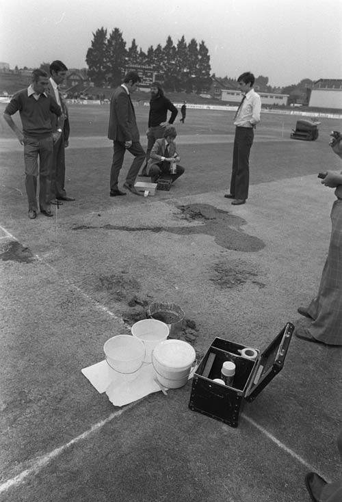 Groundsmen try to repair the damage done to the Headingley pitch ...