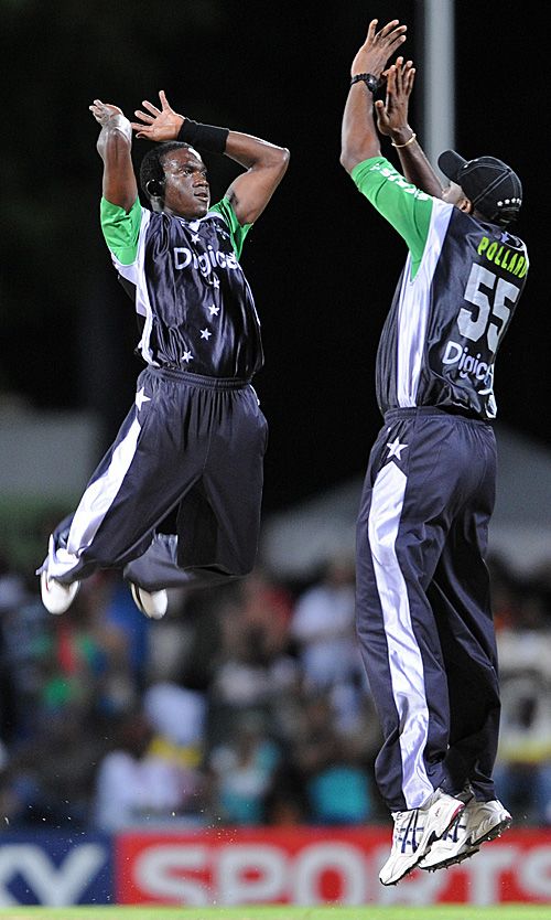 Jerome Taylor leaps up to high-five Kieron Pollard | ESPNcricinfo.com