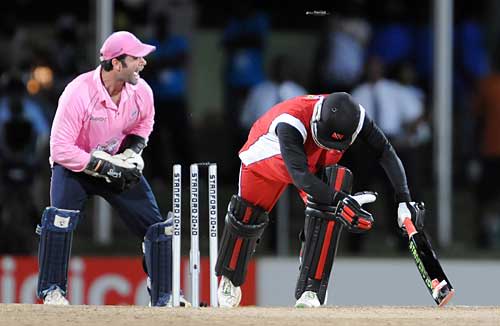 Ben Scott pulls off a sharp stumping to remove Daren Ganga ...