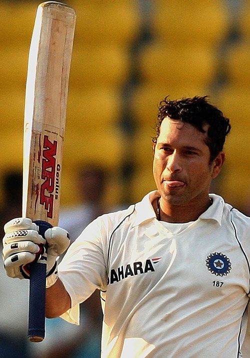 Sachin Tendulkar raises his bat after reaching his century | ESPNcricinfo.com