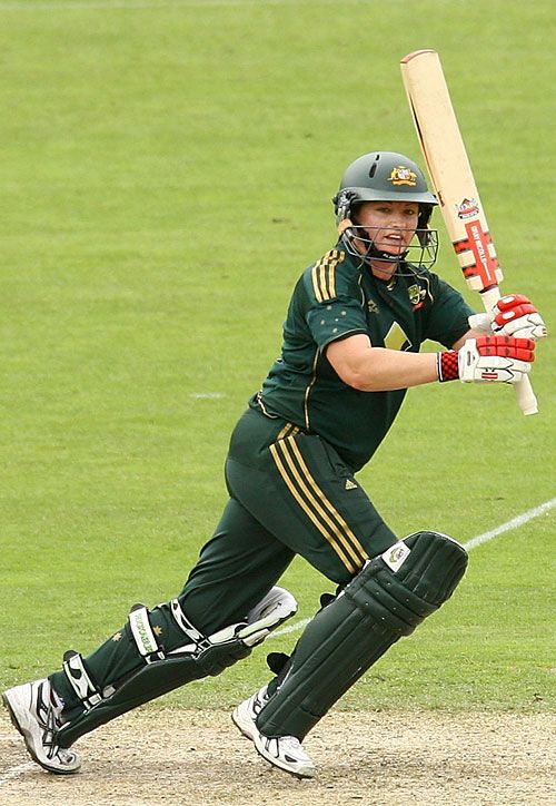 Karen Rolton plays a shot through the on-side during her century ...