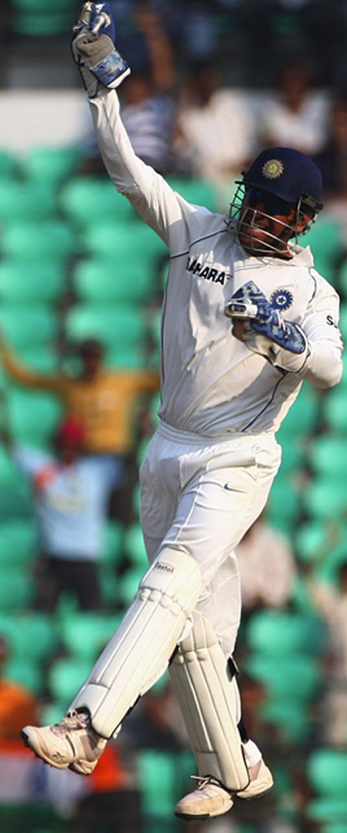 Mahendra Singh Dhoni celebrates the fall of an Australian wicket ...