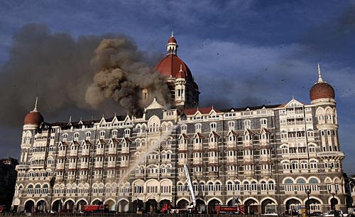 Fire fighters attempt to put out a fire at the Taj | ESPNcricinfo.com