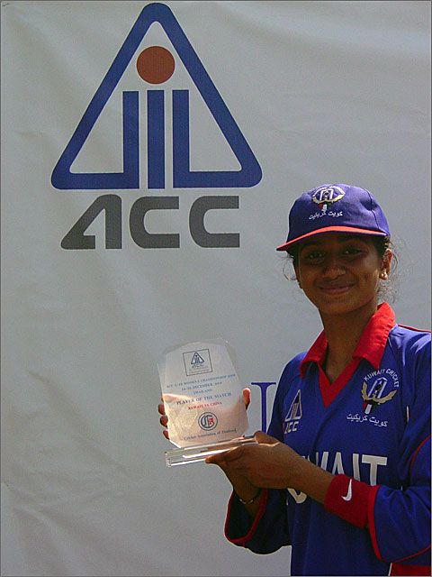 Kuwait captain Priyada Murali holds her Player-of-the-Match trophy ...