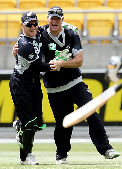 Brendon McCullum hugs Jamie How after he caught Ramnaresh Sarwan ...