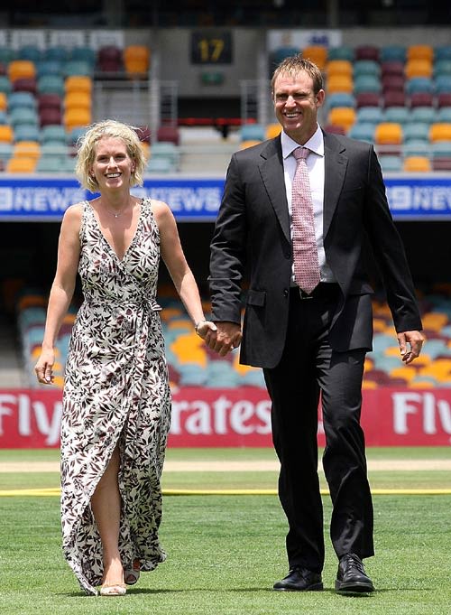 Matthew Hayden and his wife Kellie take a walk on the Gabba after he announced his retirement ...