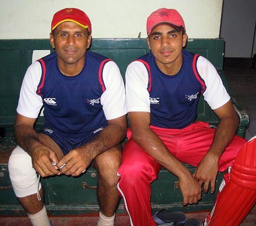 Najeeb Amar and Zain Abbas relax in the dressing room after Hong Kong's ...