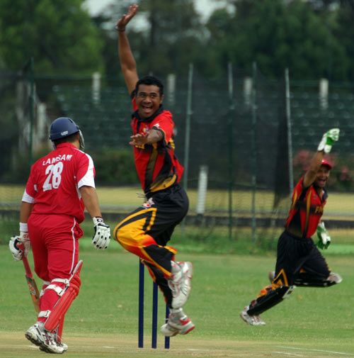 Hong Kong's Roy Lamsam is caught behind off Willie Gavera ...