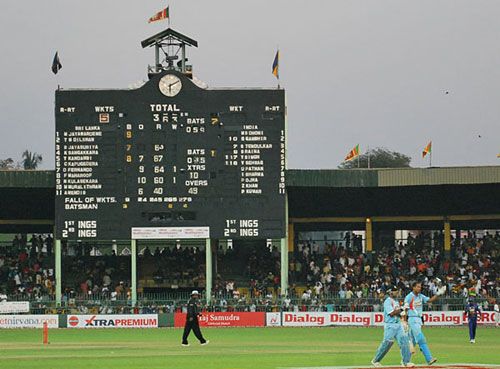 Mahendra Singh Dhoni and Yusuf Pathan walk back to the pavilion ...