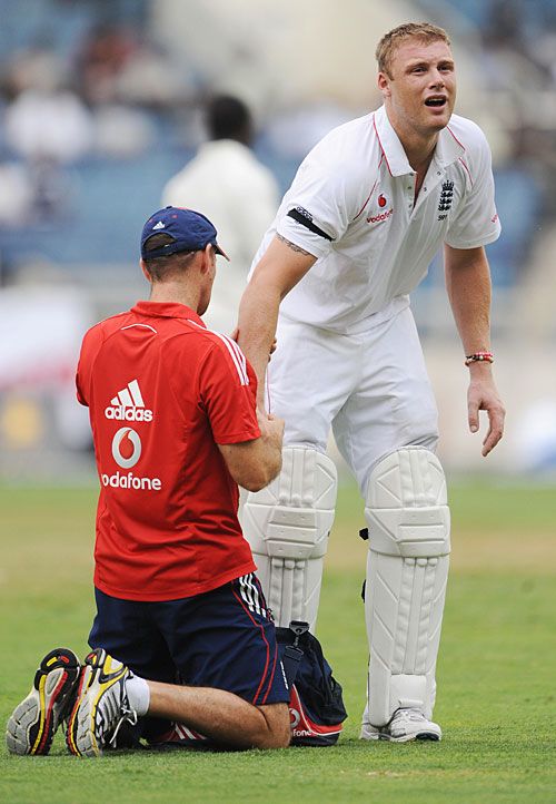 The England physio has a look at the Andrew Flintoff's bruised elbow ...