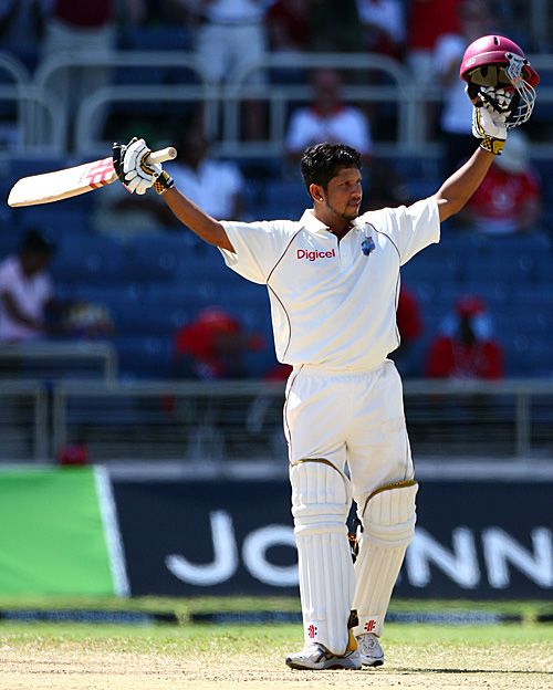 Ramnaresh Sarwan raises his arms to celebrate his hundred ...