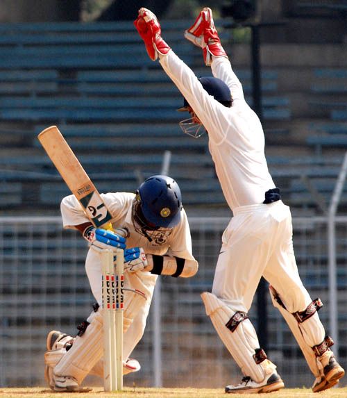 Parthiv Patel celebrates after Dinesh Karthik stepped onto the stumps ...