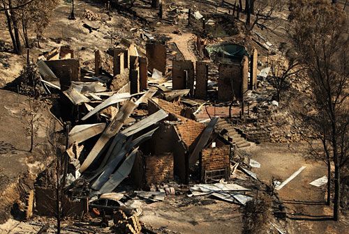 The remains of a house destroyed by bushfires | ESPNcricinfo.com
