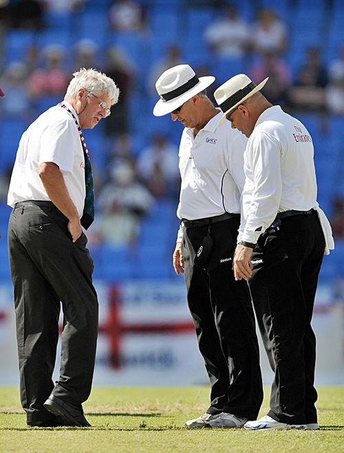 The match referee Alan Hurst inspects the pitch and run-ups with the ...