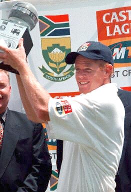 Pollock holds aloft the Castle Lager/MTN trophy | ESPNcricinfo.com