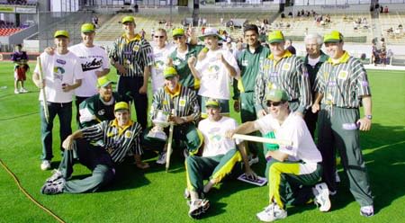 Central pose for a photo with the Shell Cup | ESPNcricinfo.com