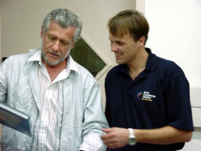ICA Chairman Stanley Perlman presents Roland Lefebvre with a book in ...