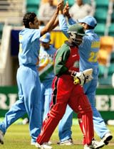 Irfan Pathan and VVS Laxman celebrate as Stuart Matsikenyeri walks back | ESPNcricinfo.com