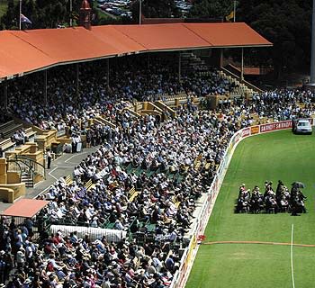 Thousands cram the stands at the Adelaide Oval during a funeral service ...