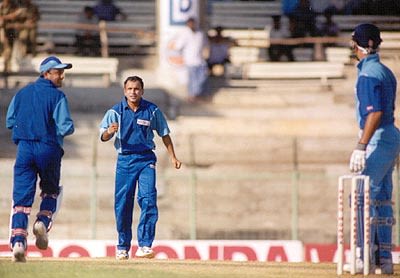 Nayan Mongia runs across to greet the bowler Sanghvi after snapping up ...
