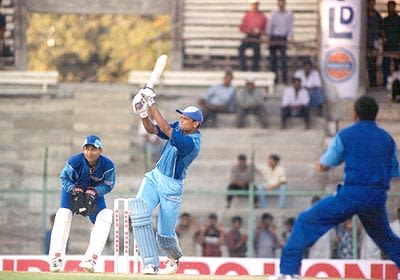Badani lifts Sanghvi for a six on his way to an unbeaten 64 ...