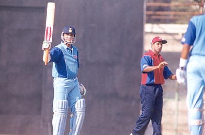Ganguly raises his bat after reaching his fifty | ESPNcricinfo.com