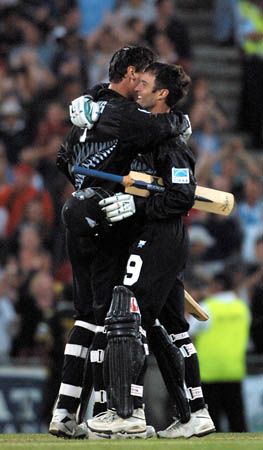 Astle is hugged by Fleming upon reaching his century | ESPNcricinfo.com