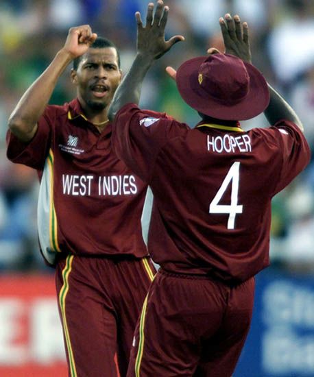 Mervyn Dillon celebrates with captain Carl Hooper after dismissing ...