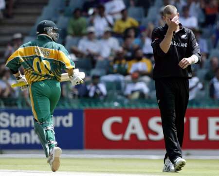 New Zealand's Jacob Oram reacts after being hit for four in the match ...