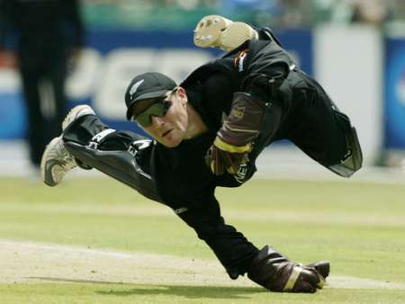 New Zealand wicket-keeper Brendon McCullum dives to stop a ball ...