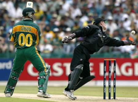 New Zealand keeper Brendon McCullum dives to stop the ball against ...