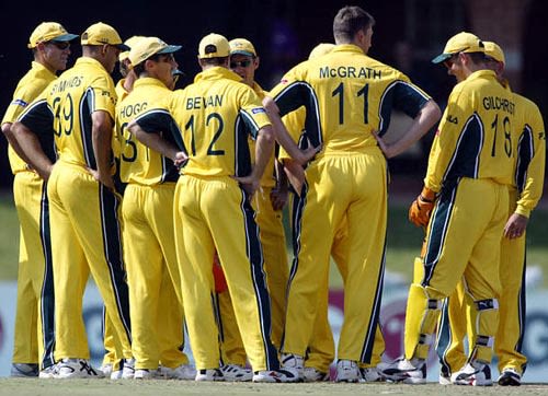 Australian team stand together waiting for the next Namibian batsman ...
